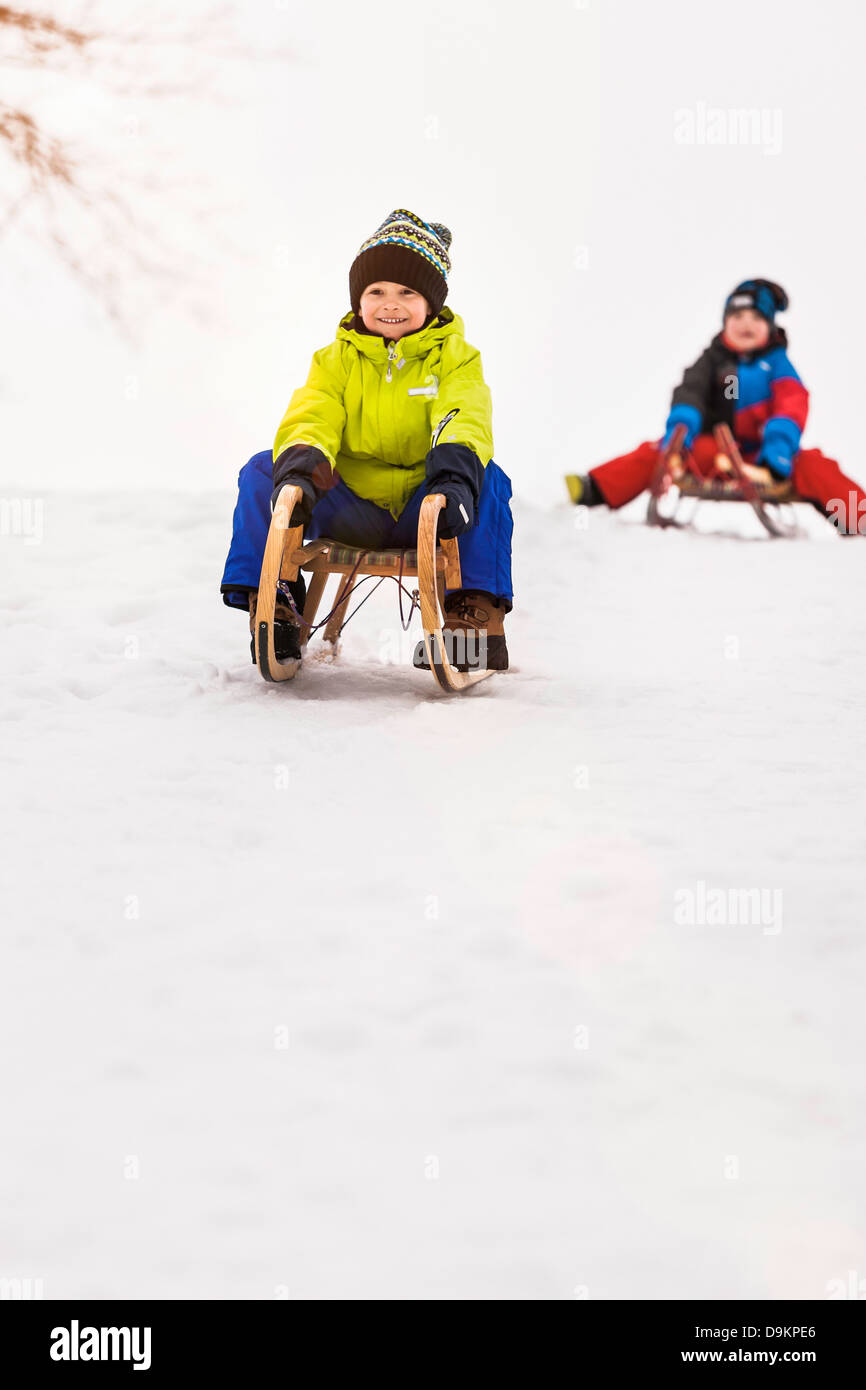Two boys sitting playing in hi-res stock photography and images - Alamy