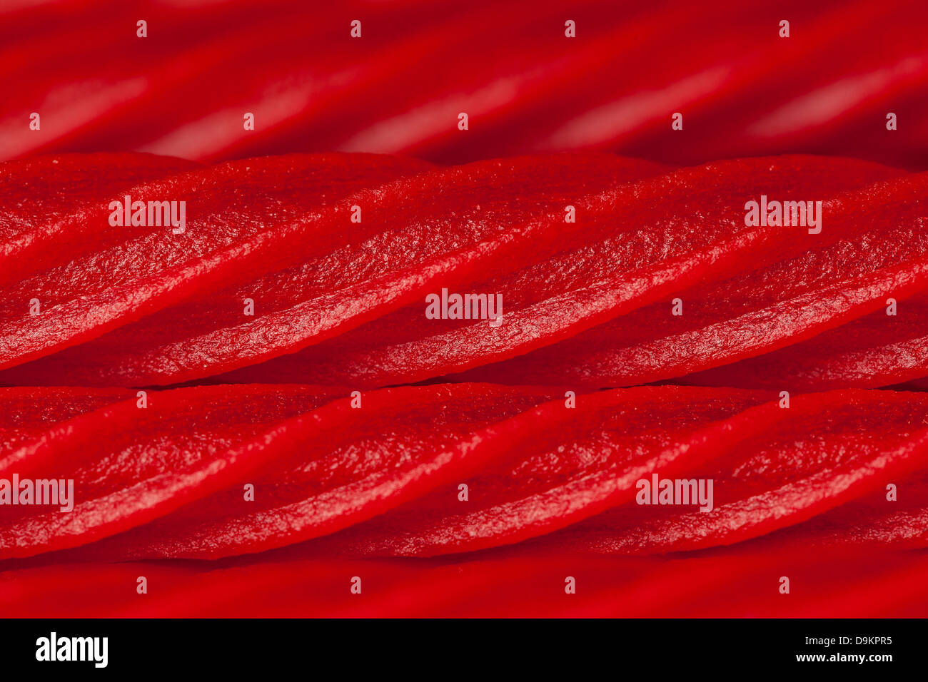 Bright Red Licorice Candy shaped like a twisted rope Stock Photo - Alamy