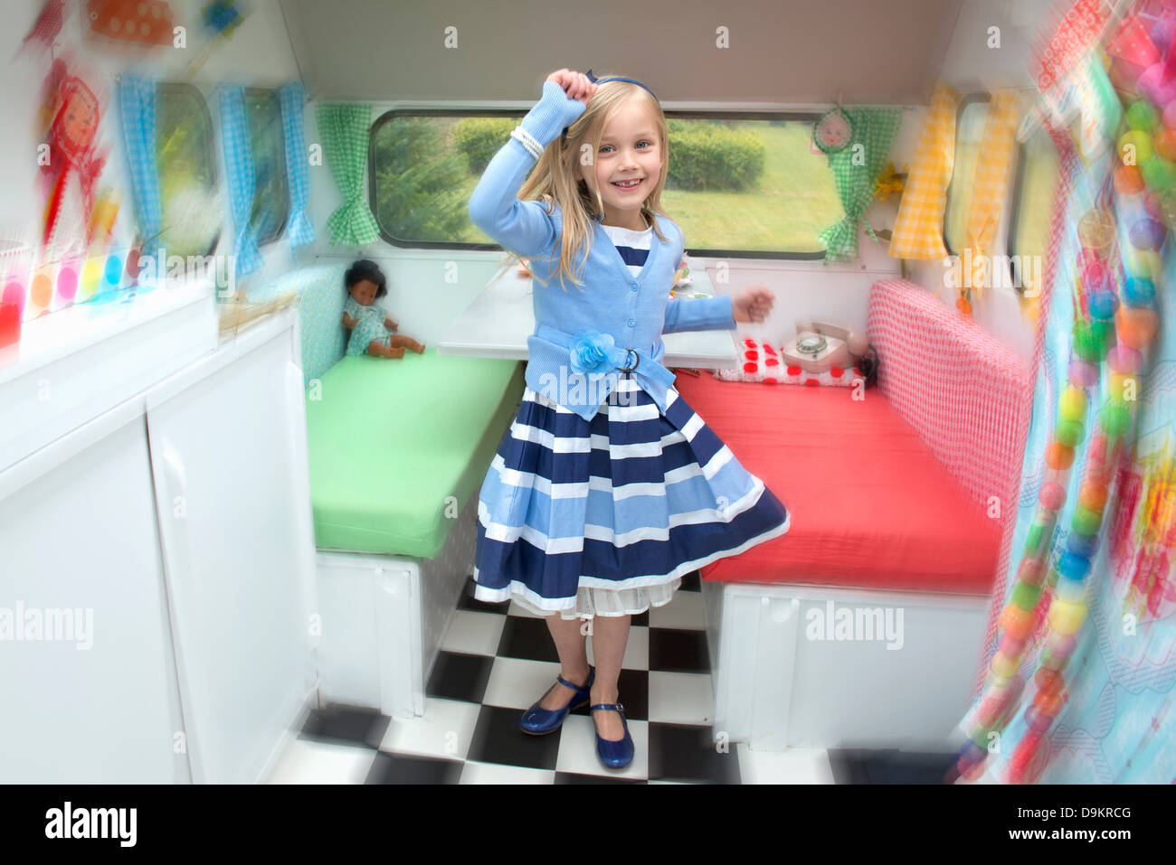 Portrait of young girl dancing in caravan Stock Photo - Alamy