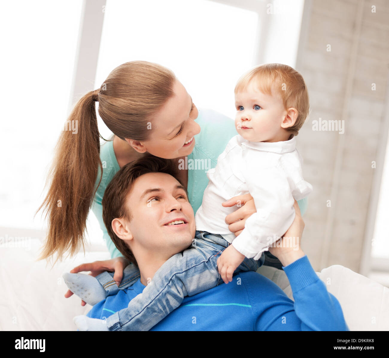 happy parents playing with adorable baby Stock Photo - Alamy
