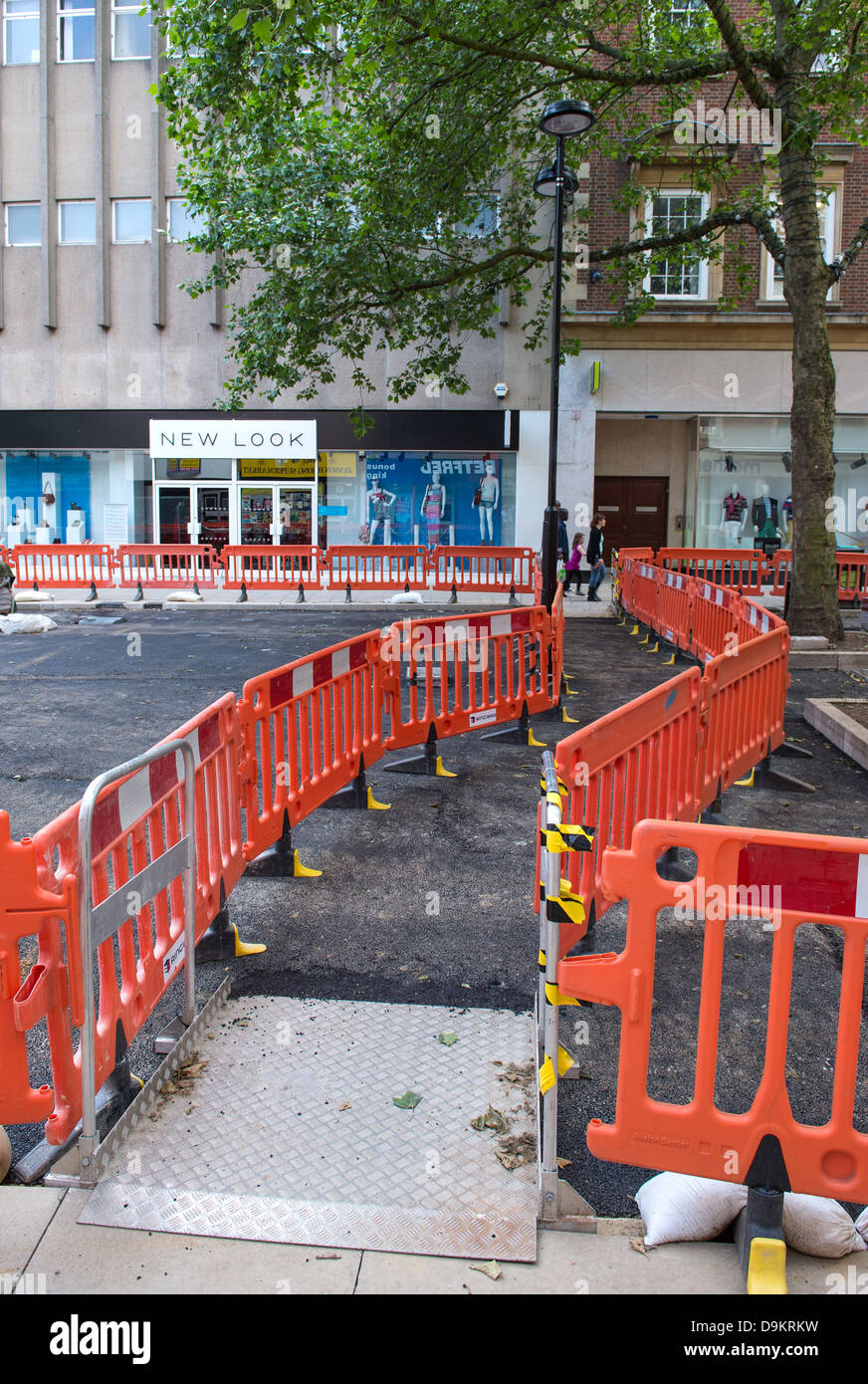 Development of Peterborough city centre with barriers around the work ...