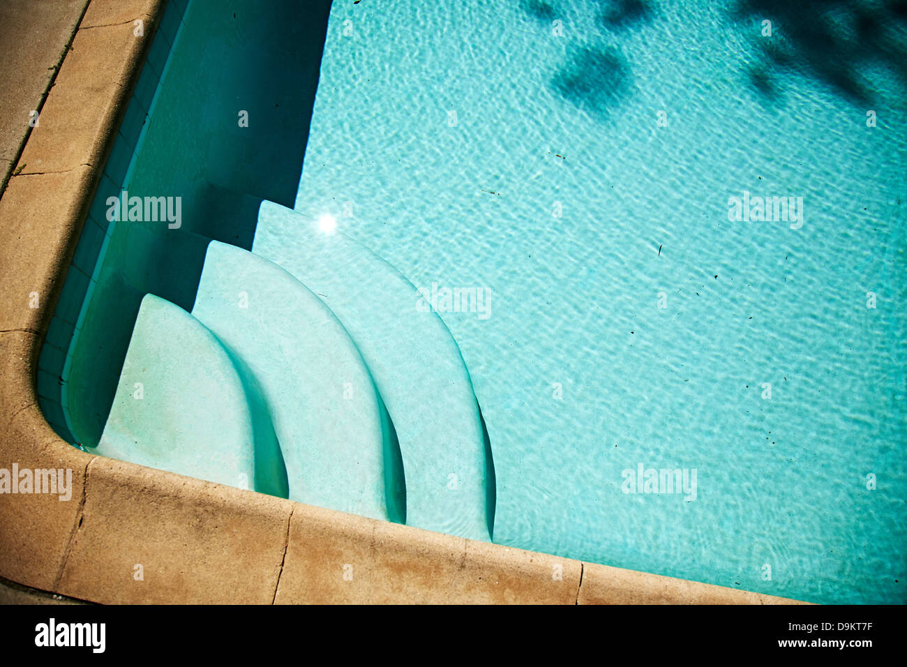 Steps in corner of outdoor swimming pool Stock Photo - Alamy