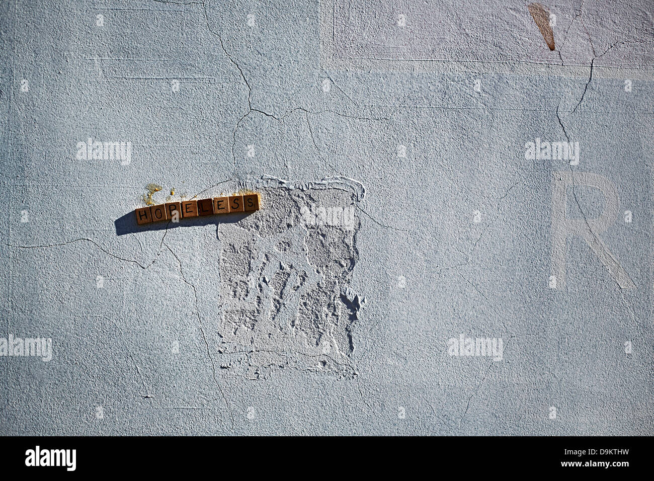 Wooden cubes spelling word hopeless on white background Stock Photo - Alamy