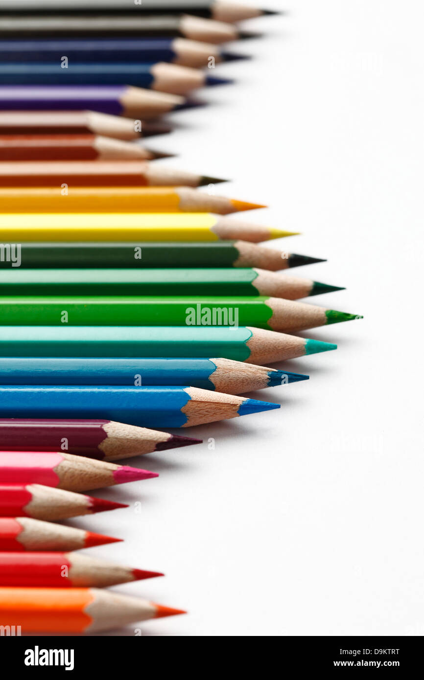 A Colored Pencils arranged horizontally in a line Stock Photo - Alamy