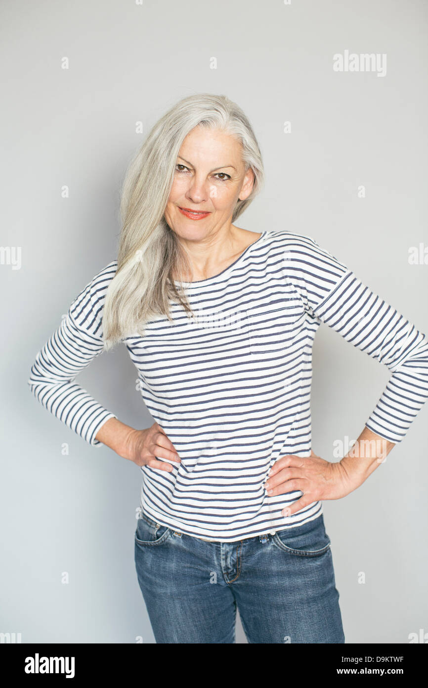 Woman in confident pose Stock Photo - Alamy