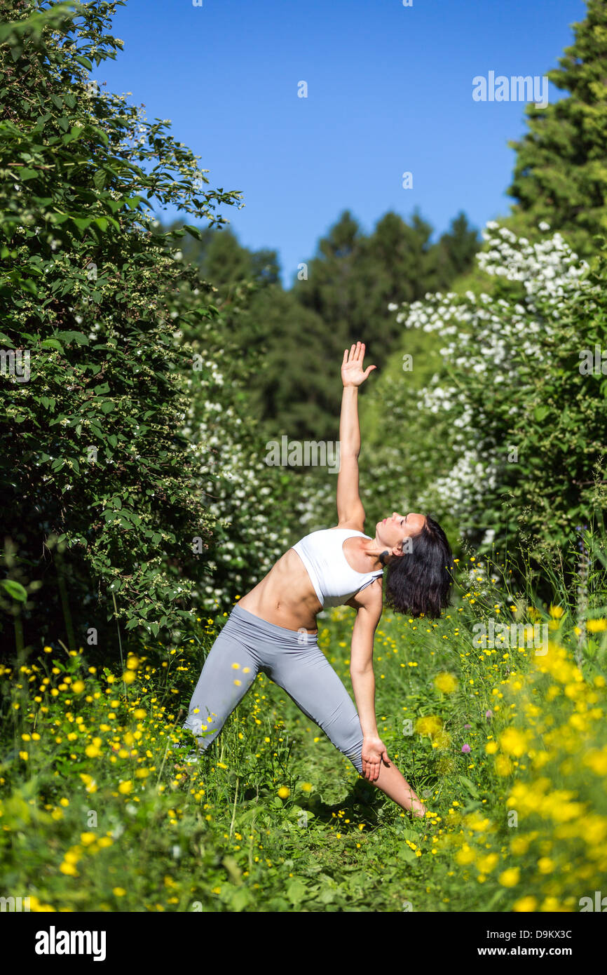 girl doing yoga outdoor, vertical Stock Photo - Alamy