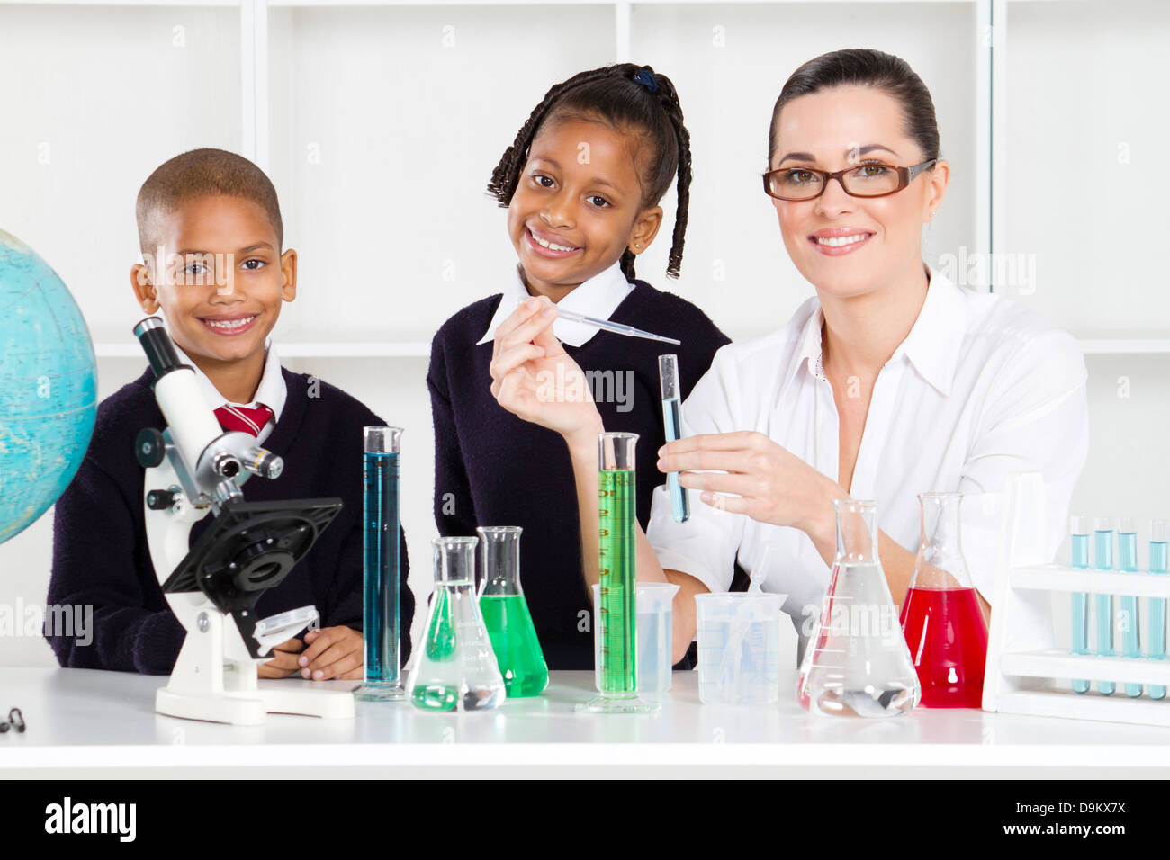 primary school students and teacher in science class Stock Photo - Alamy