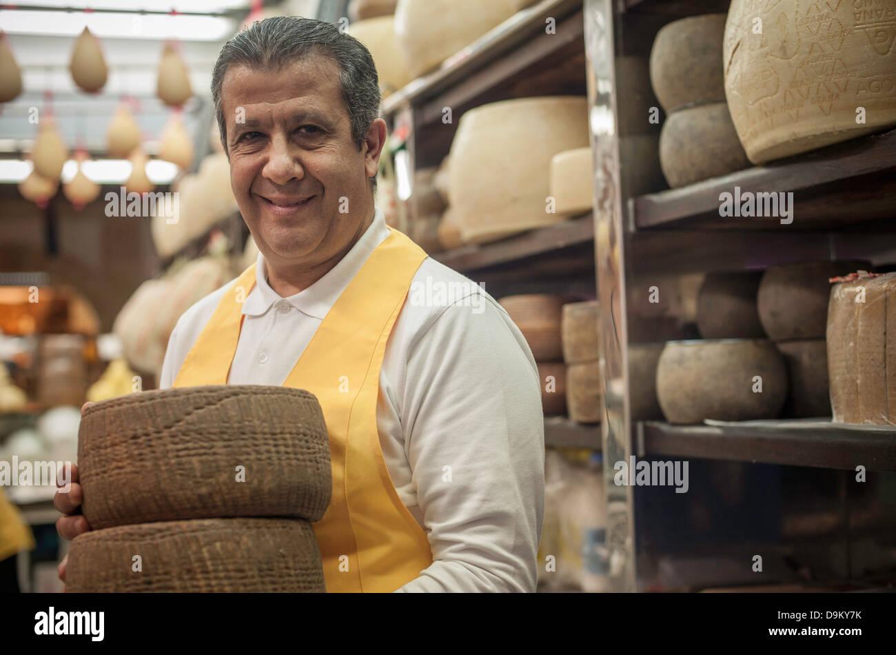 Man in cheese shop Stock Photo - Alamy