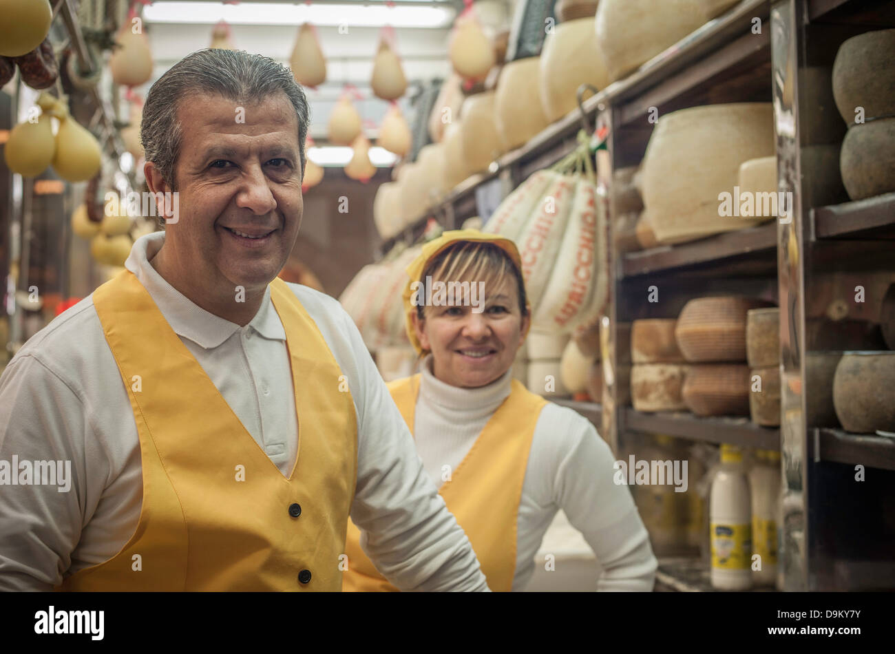 Man and woman in cheese shop Stock Photo - Alamy