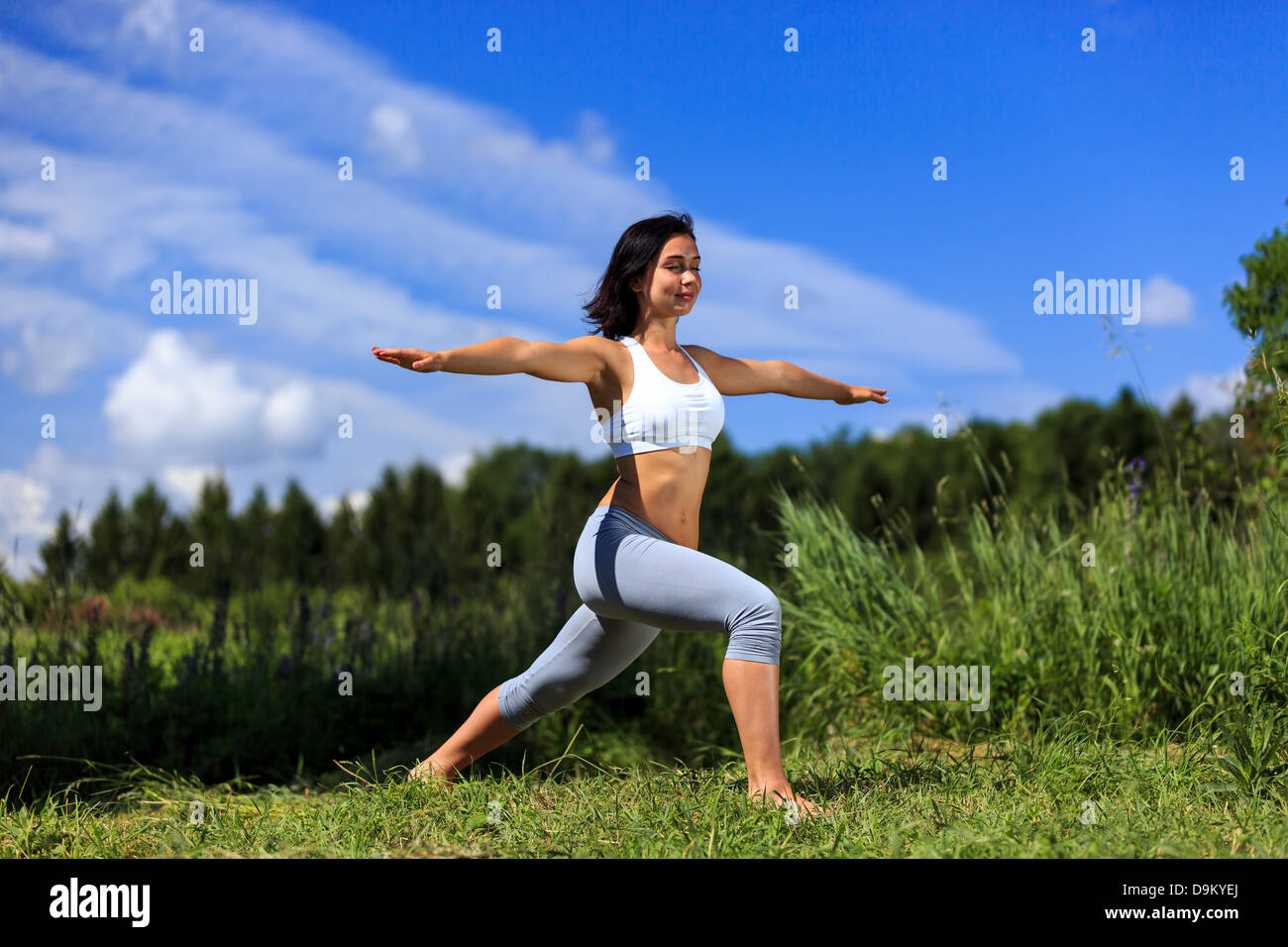 girl doing yoga outdoor with closed eyes, ladscape Stock Photo - Alamy