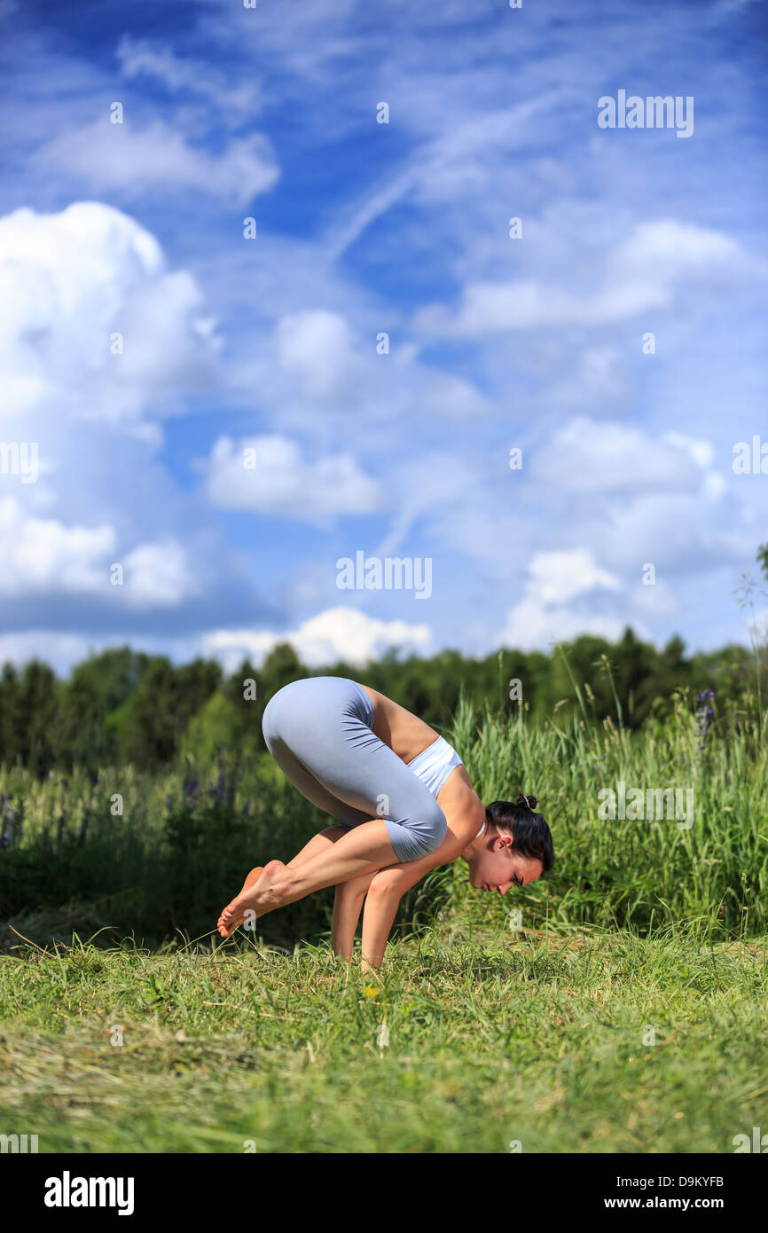 girl doing yoga outdoor, vertical Stock Photo - Alamy