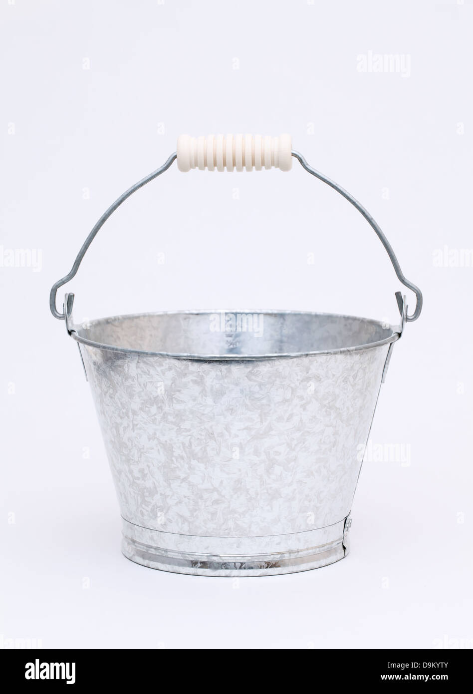 Empty metal bucket on gray background Stock Photo - Alamy