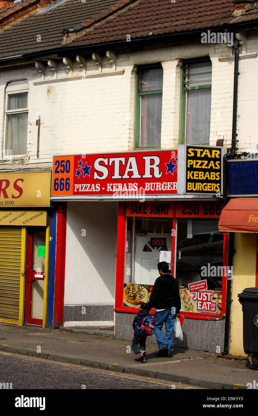 Fast food shop selling burgers and kebabs and pizza Stock Photo - Alamy