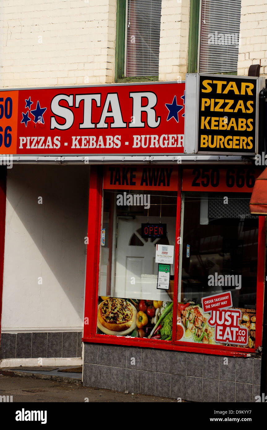 Fast food shop selling burgers and kebabs and pizza Stock Photo - Alamy