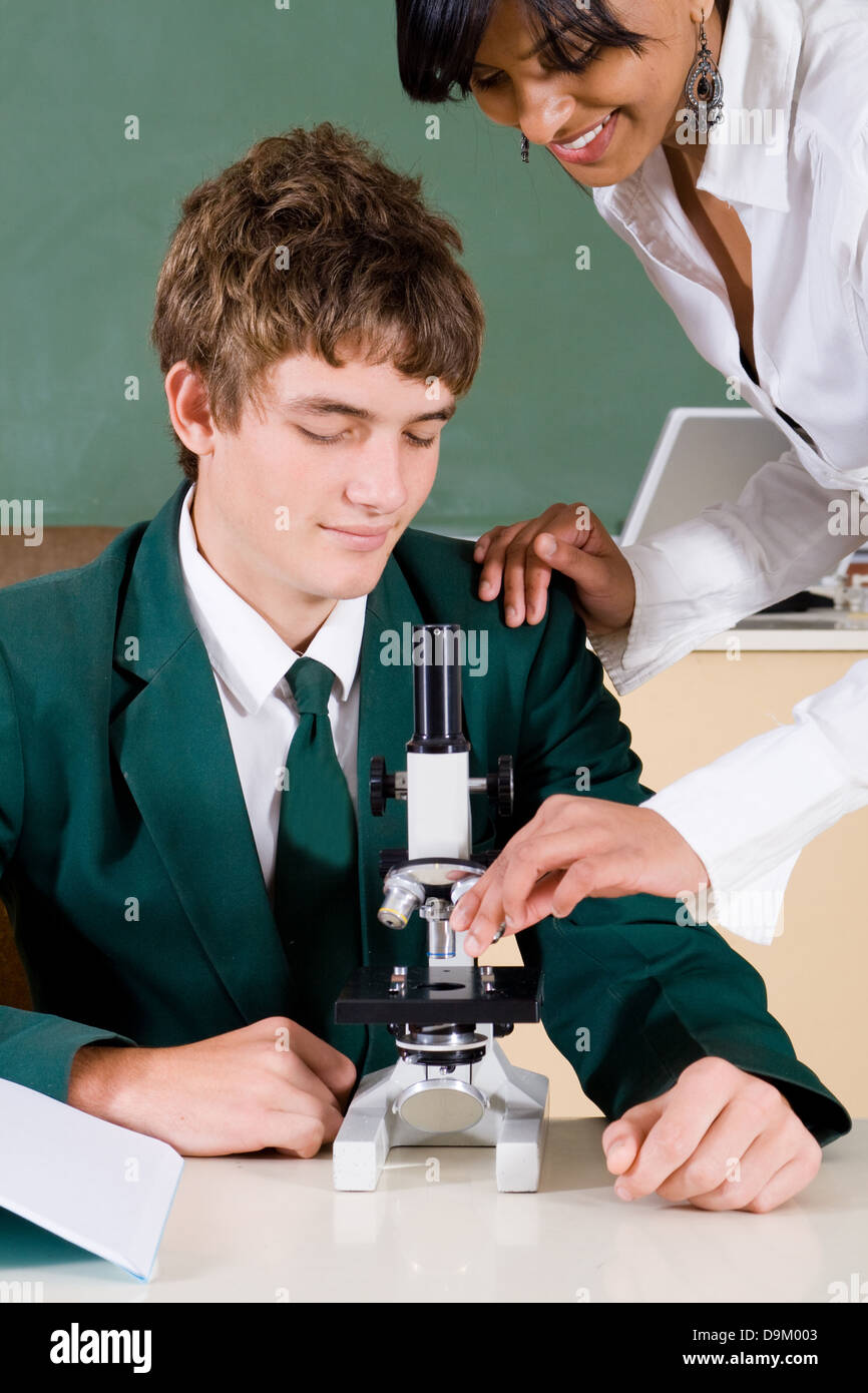 female teacher teaching high school student in science class Stock ...