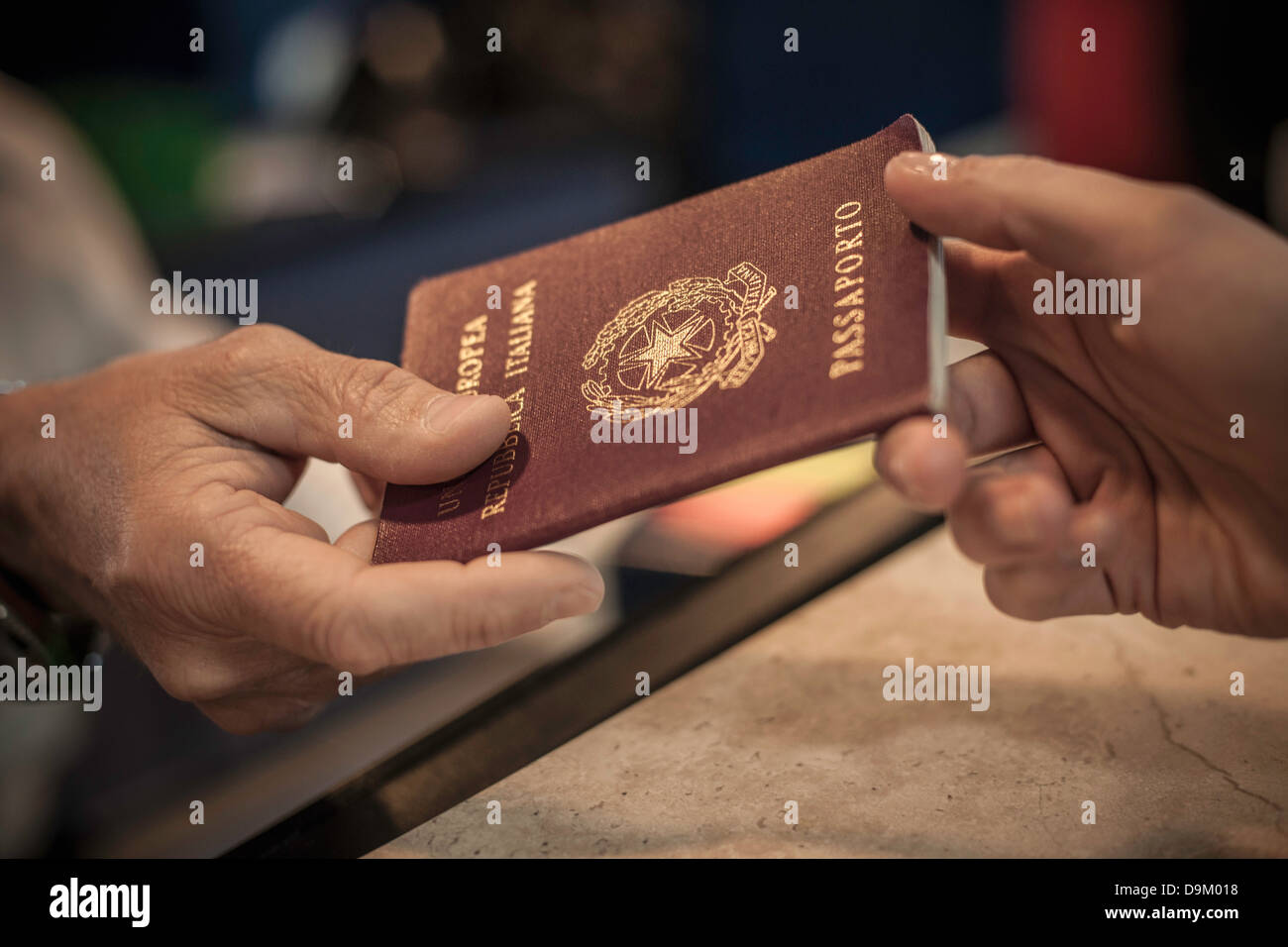 Person handing over passport, close up Stock Photo - Alamy