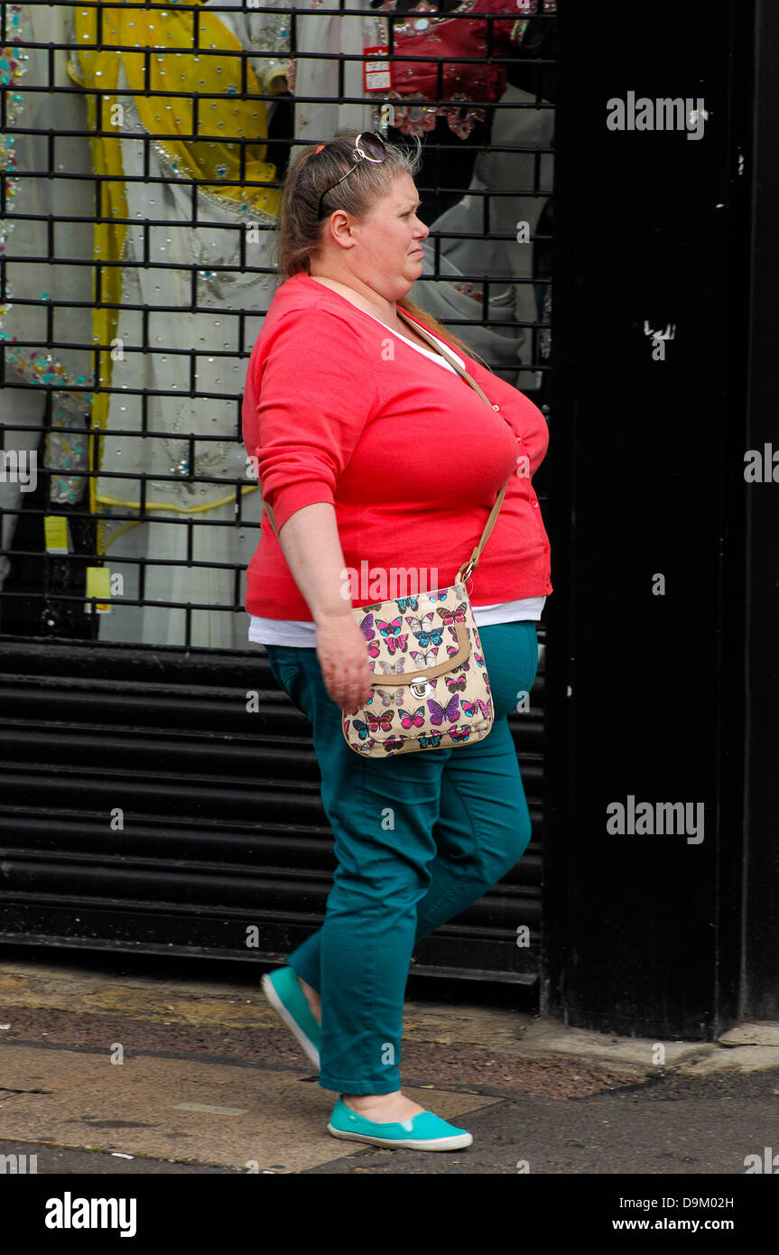 A fat overweight obese lady walking Stock Photo - Alamy