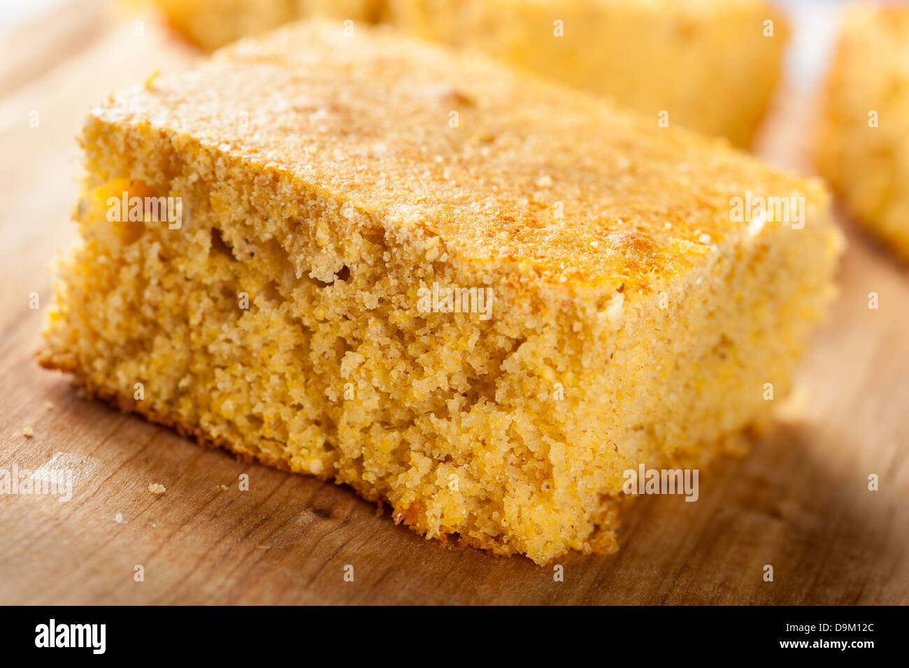 Golden Organic Homemade Cornbread cut into squares Stock Photo - Alamy