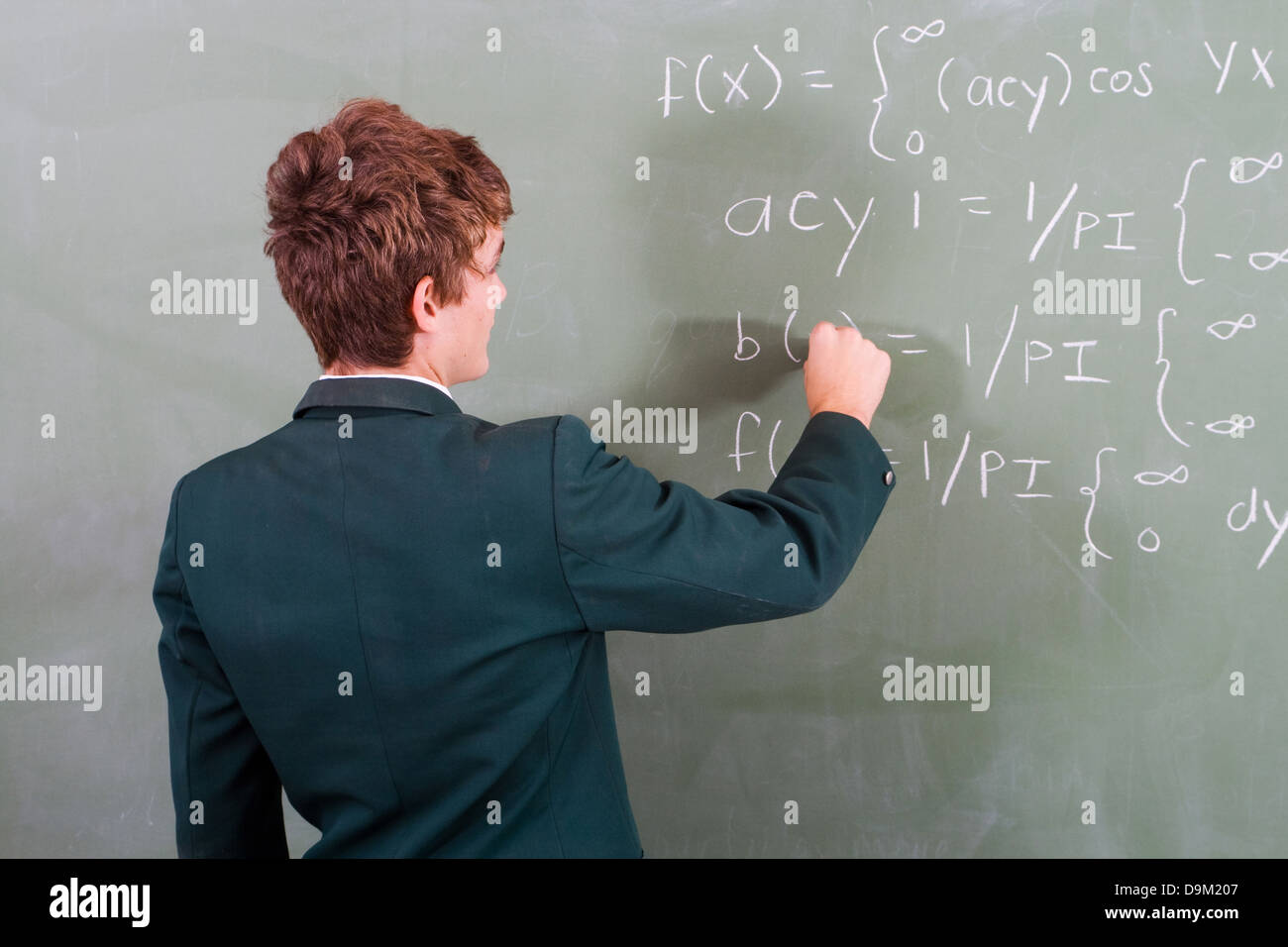 high school student write on blackboard Stock Photo - Alamy