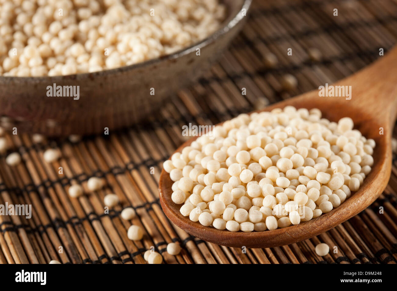 Organic Raw Middle Eastern Couscous against a background Stock Photo ...