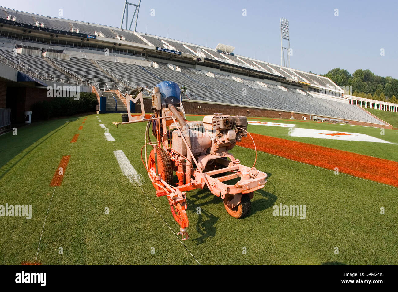 The University of Virginia Sports Field Management staff paints the ...