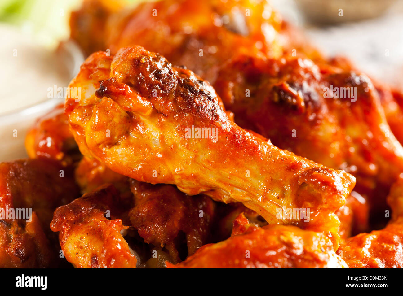Hot and Spicey Buffalo Chicken Wings with celery Stock Photo - Alamy
