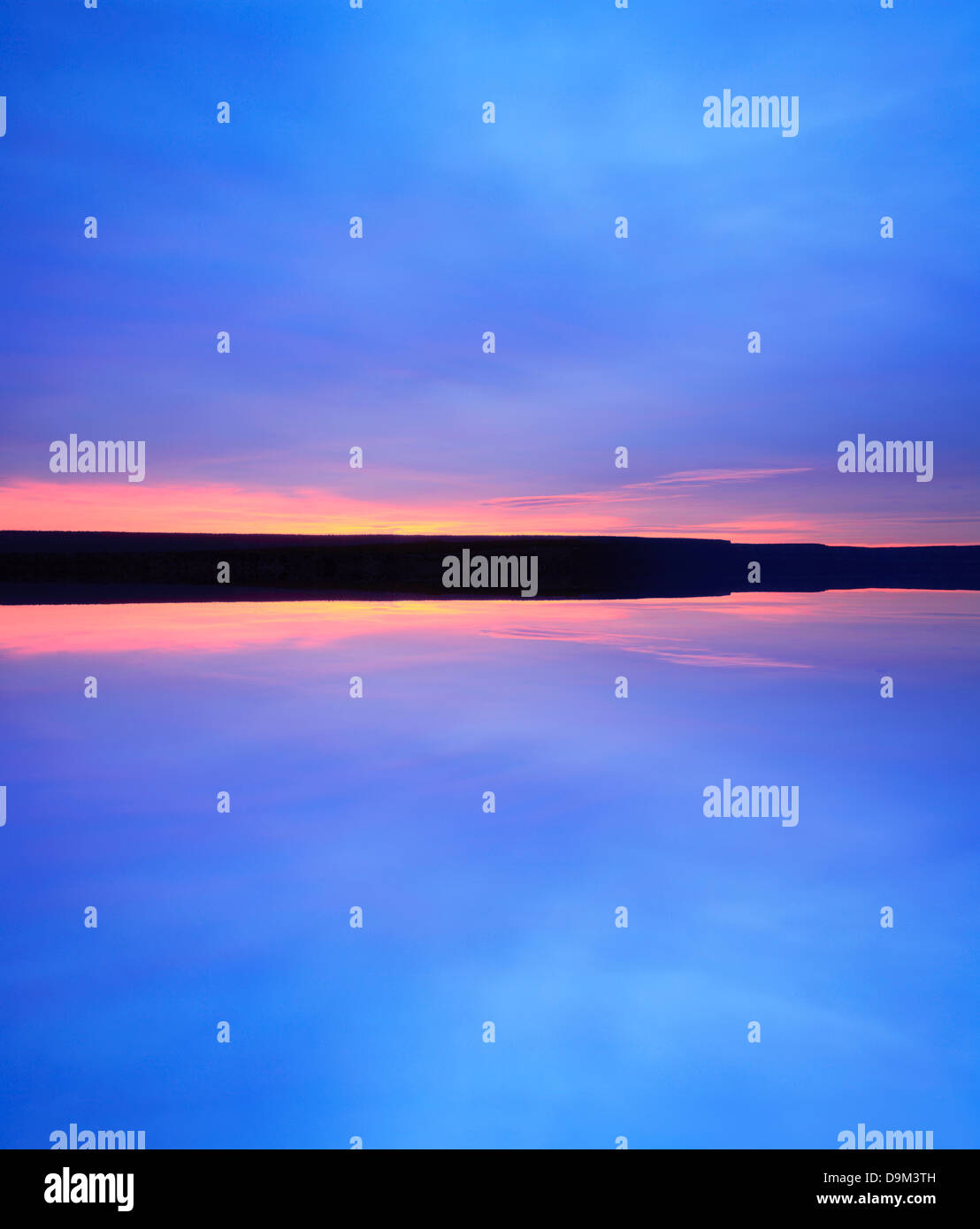 A Symmetrical Blue Sunset Sky And Nature Background Stock Photo - Alamy