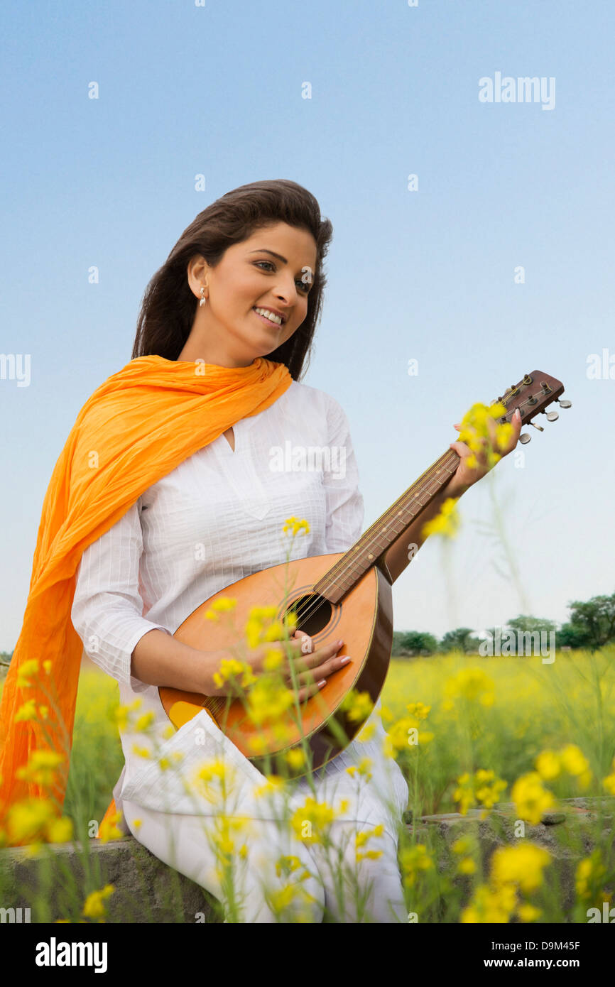 Woman playing mandolin hi-res stock photography and images - Alamy