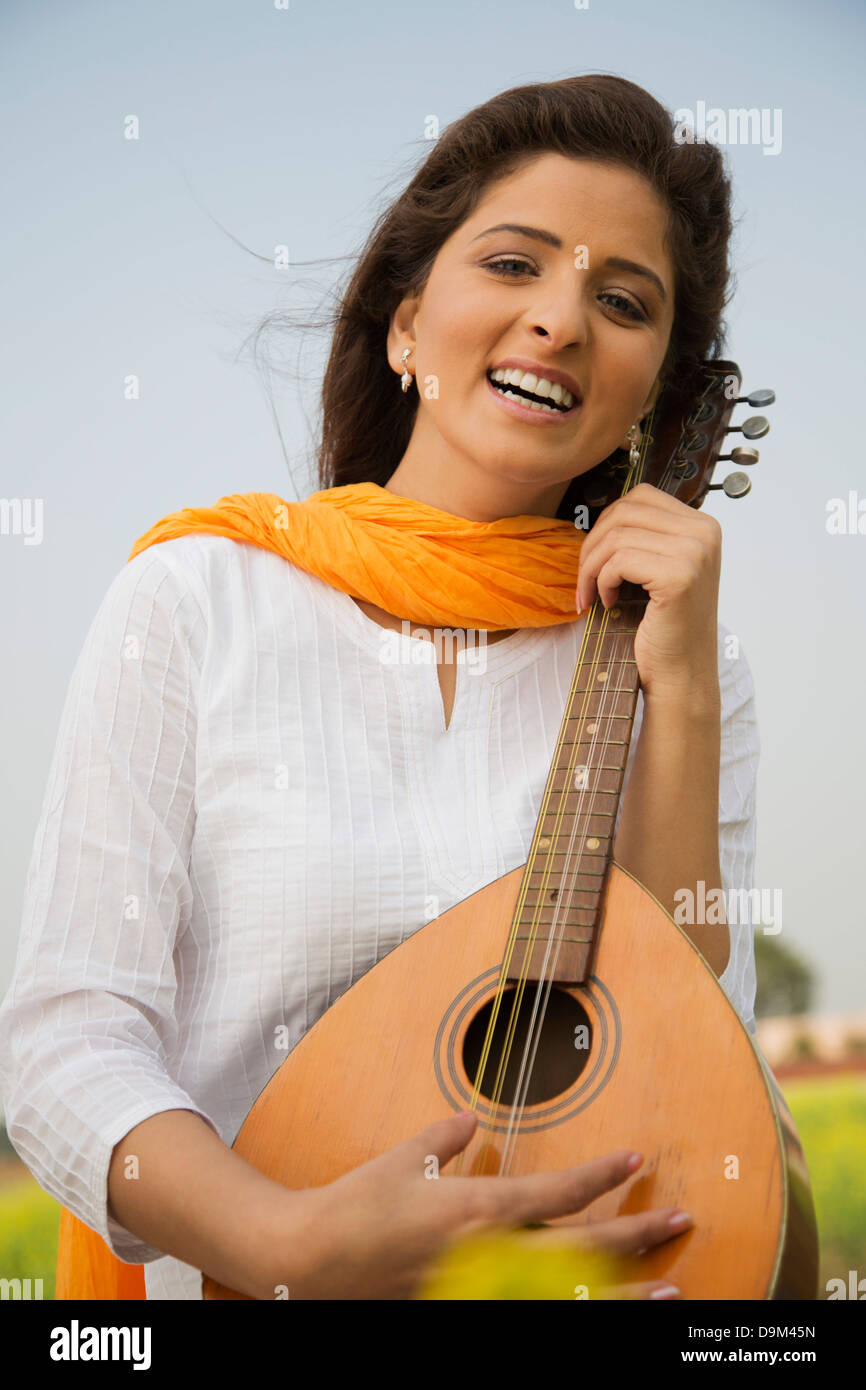 Woman playing mandolin hi-res stock photography and images - Alamy