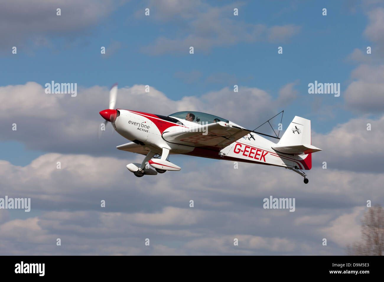Extra EA300-200 G-EEEK in flight over Breighton Airfield Stock Photo ...