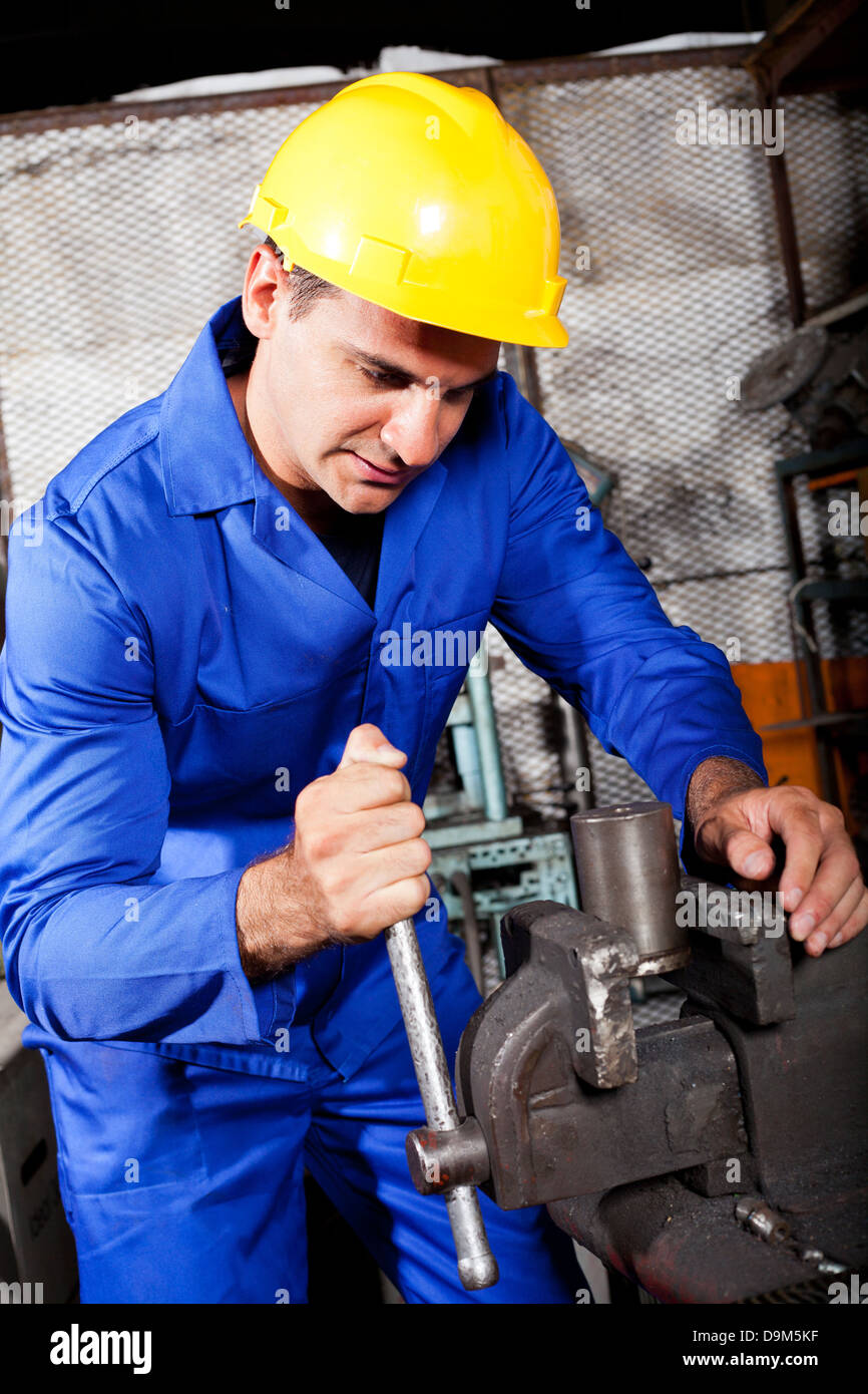 industrial machinist working on vice grip in workshop Stock Photo - Alamy
