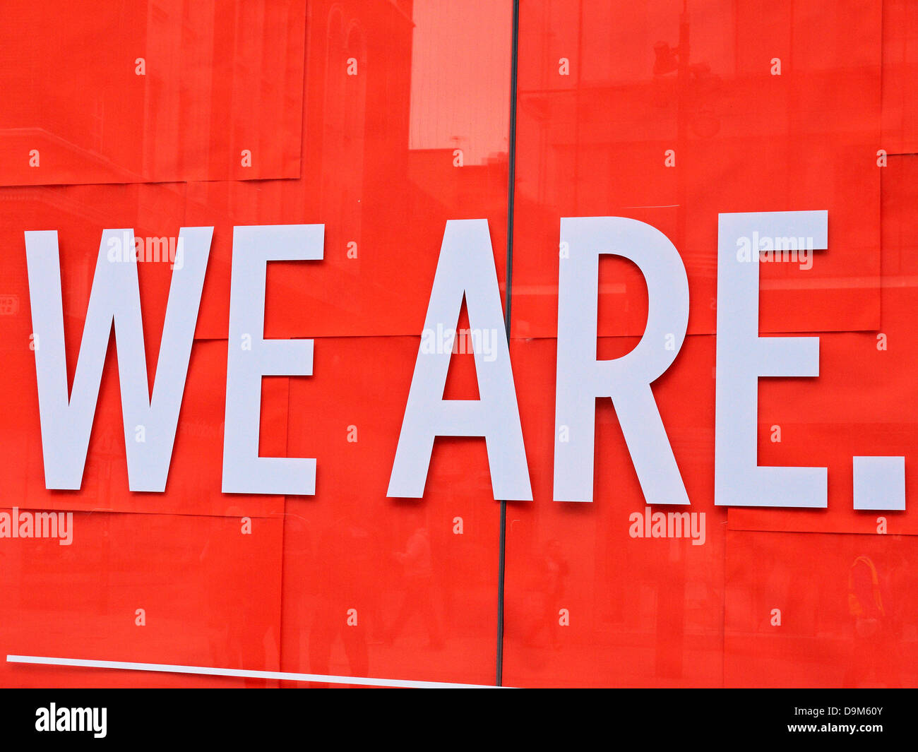 We are lettering on display window in Liverpool UK Stock Photo - Alamy