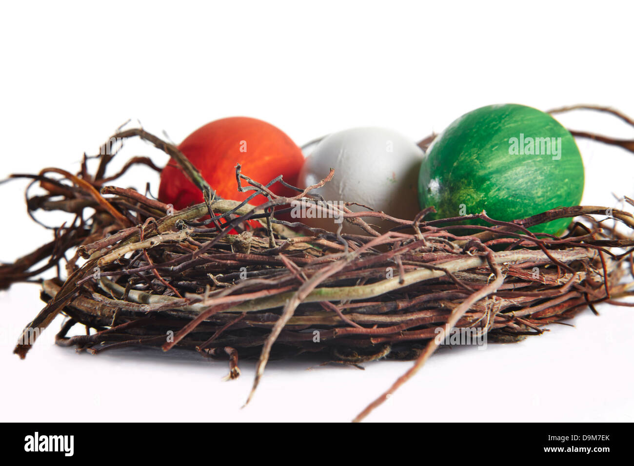 Close-up of tri coloured eggs in nest Stock Photo - Alamy