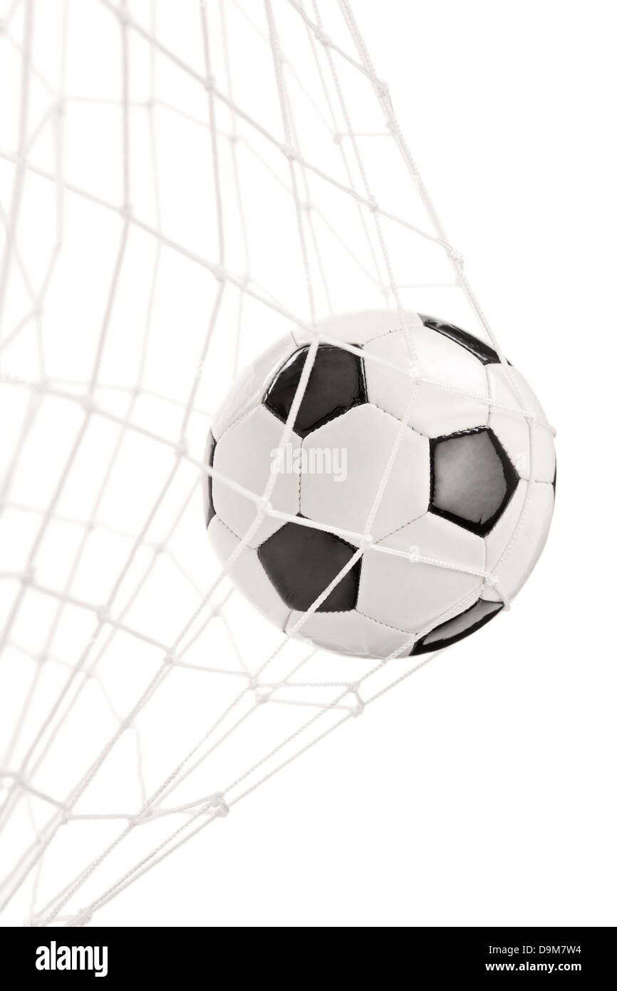 Soccer ball in a goal net Stock Photo - Alamy