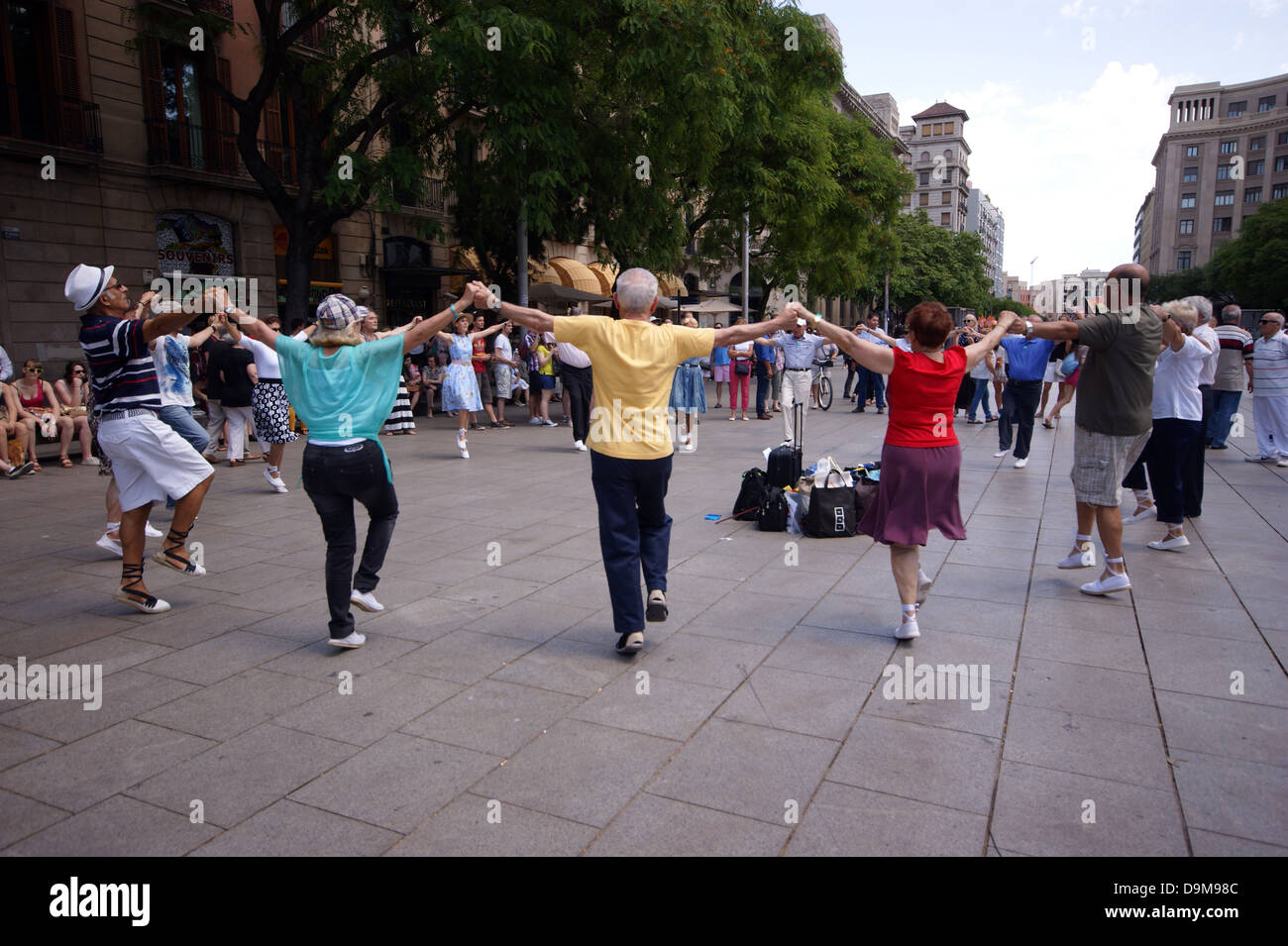 Spanish People dancing their traditional dance the Sardana outside the ...