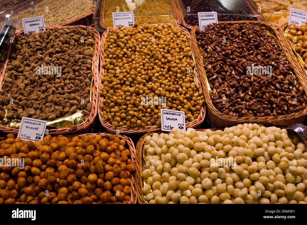 Selection of different varieties of nuts displayed on a stall in wicker ...