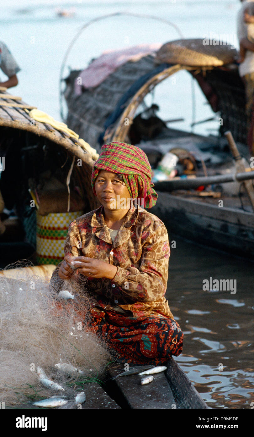 Woman removing fish hi-res stock photography and images - Alamy