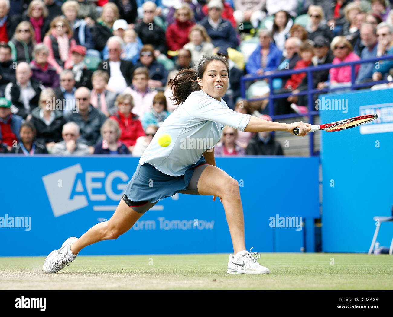 Eastbourne, UK. 22nd June 2013. Jamie Hampton(USA) returns the ball ...