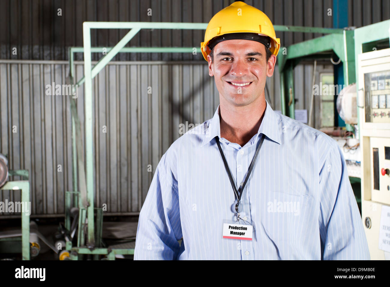 happy male production manager portrait inside factory Stock Photo - Alamy