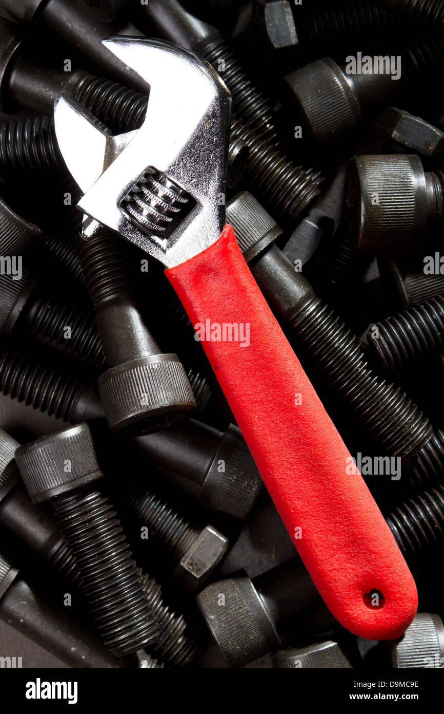 Wrench on black bolts Stock Photo - Alamy