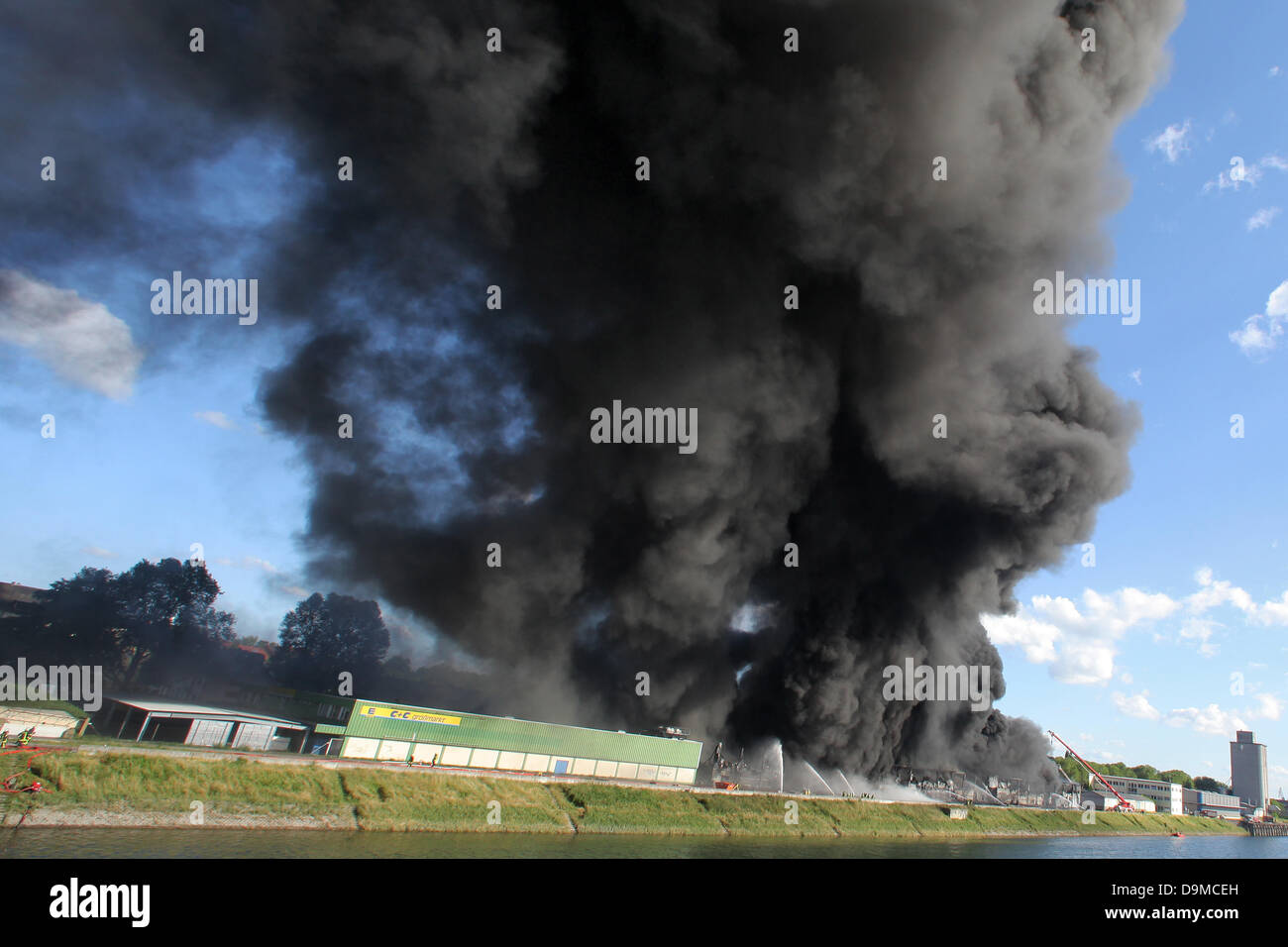 Ludwigshafen, Germany. 22nd June, 2013. Fire fighters extinguish a fire ...