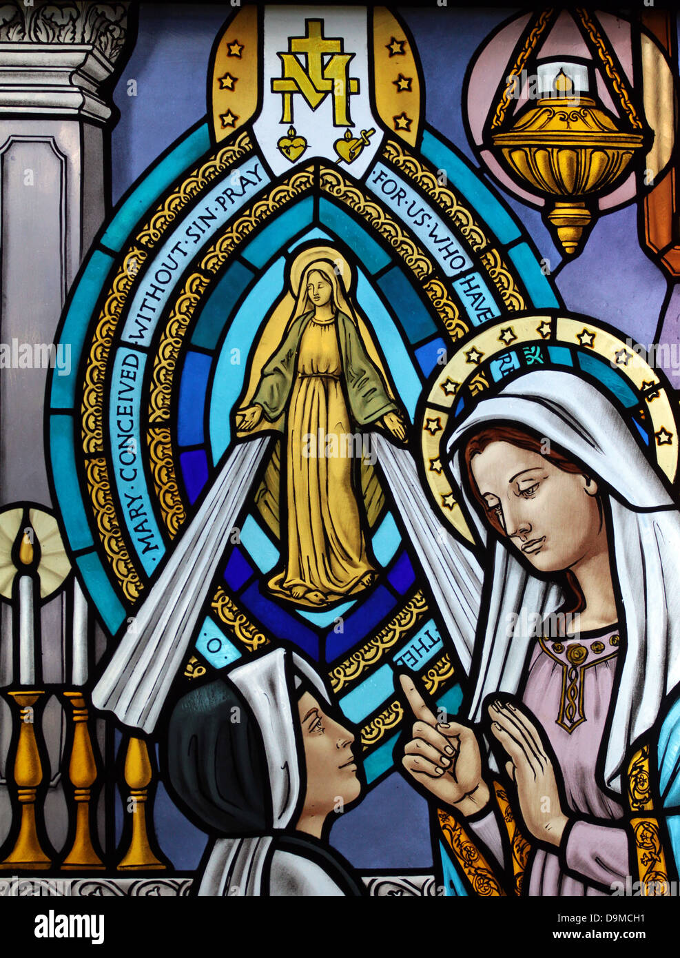 Stained glass art in the windows of the Mary, Queen of the Universe ...