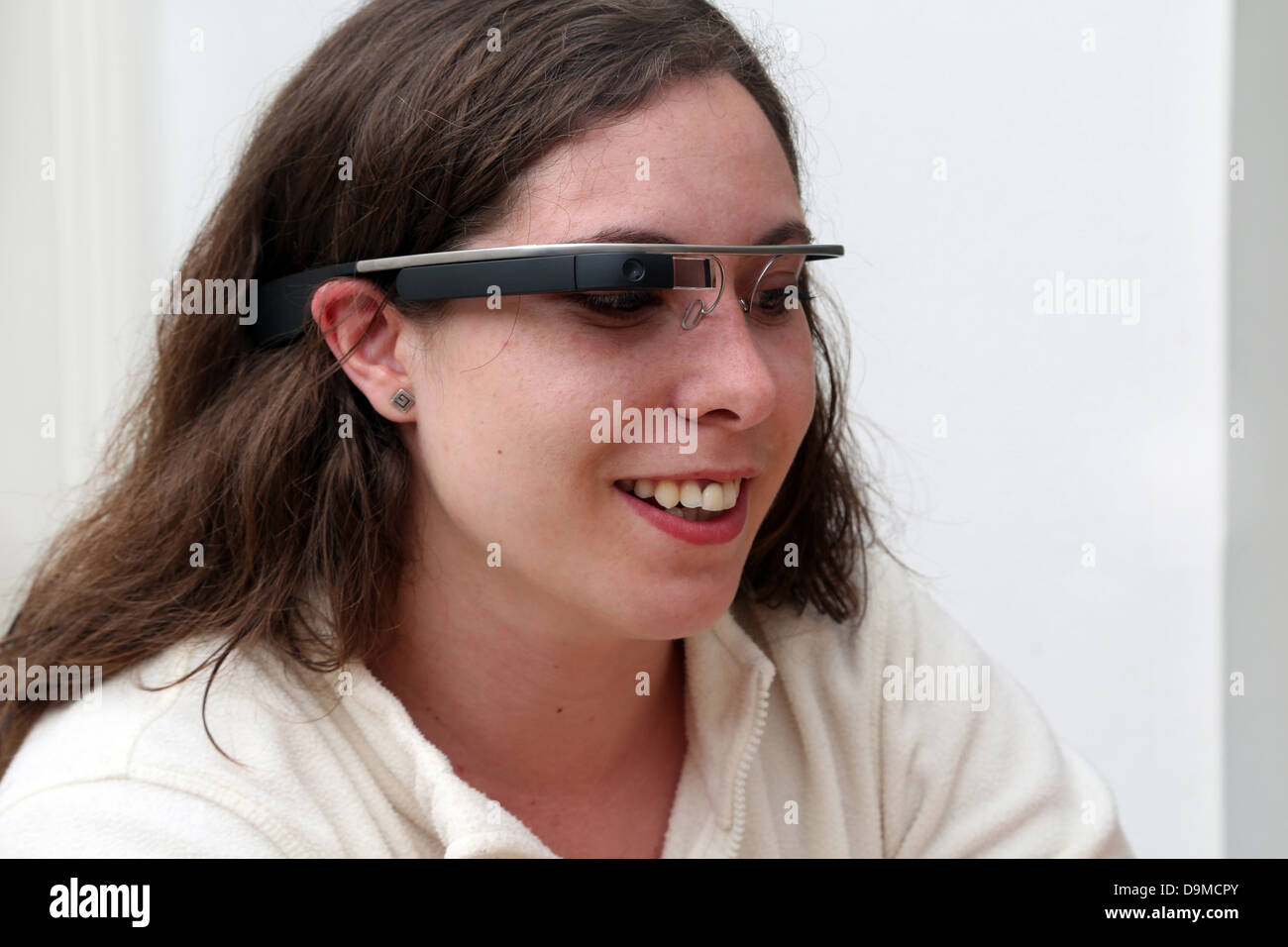 Woman Wearing Google glass which can take photos, videos and stream ...