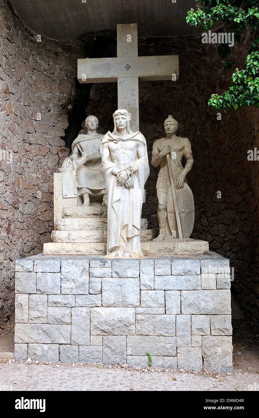 Christian monument where three people seen Stock Photo - Alamy