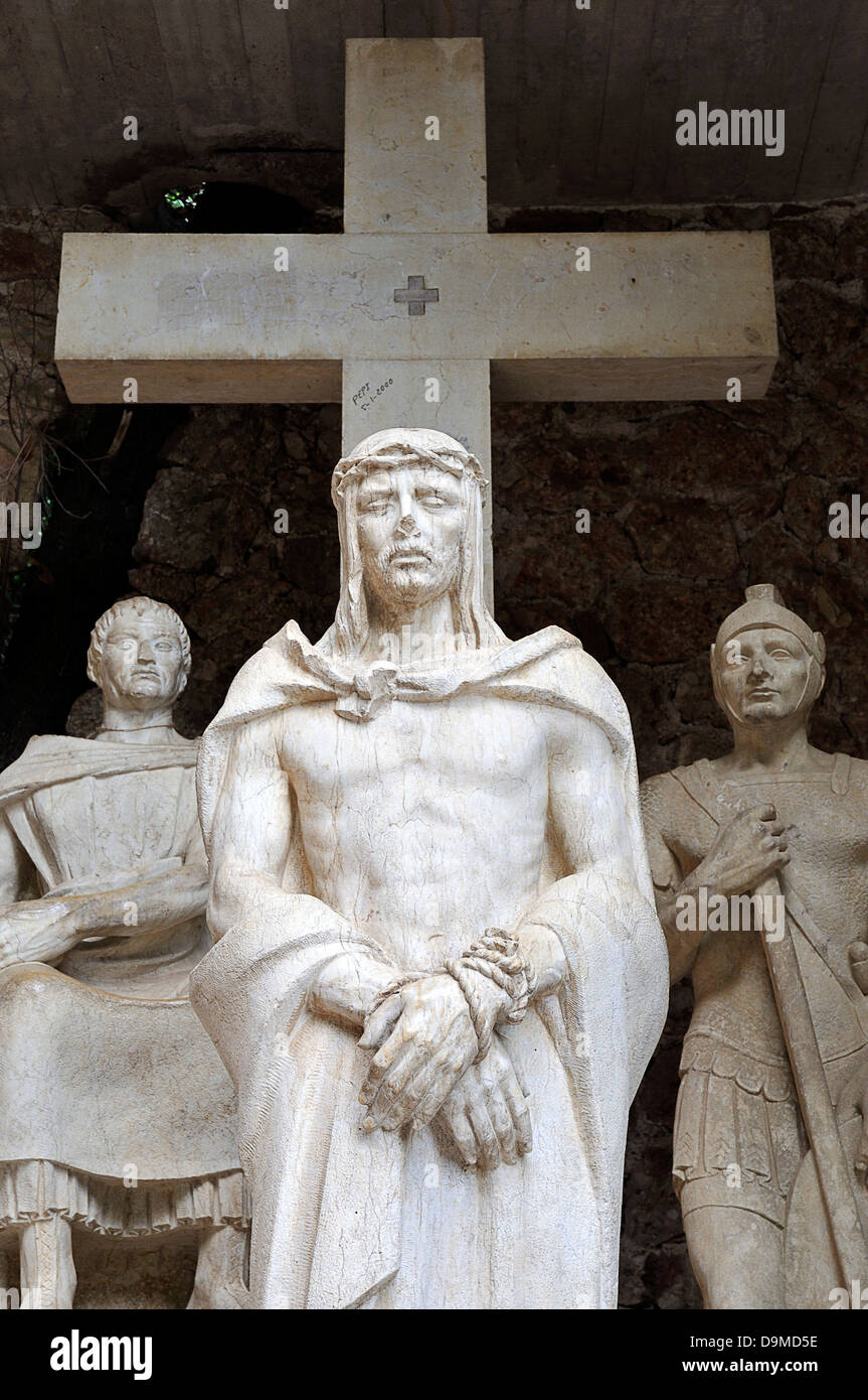 Christian monument where three people seen Stock Photo - Alamy