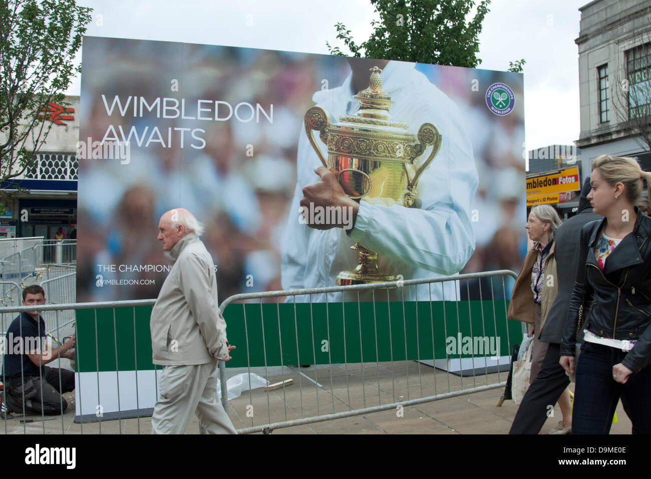 Wimbledon London, UK. 22nd June 2013. Workmen construct a giant poster ...