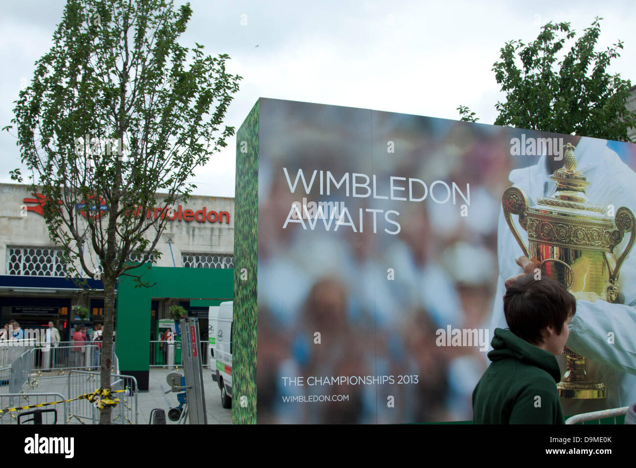 Wimbledon London, UK. 22nd June 2013. Workmen construct a giant poster ...
