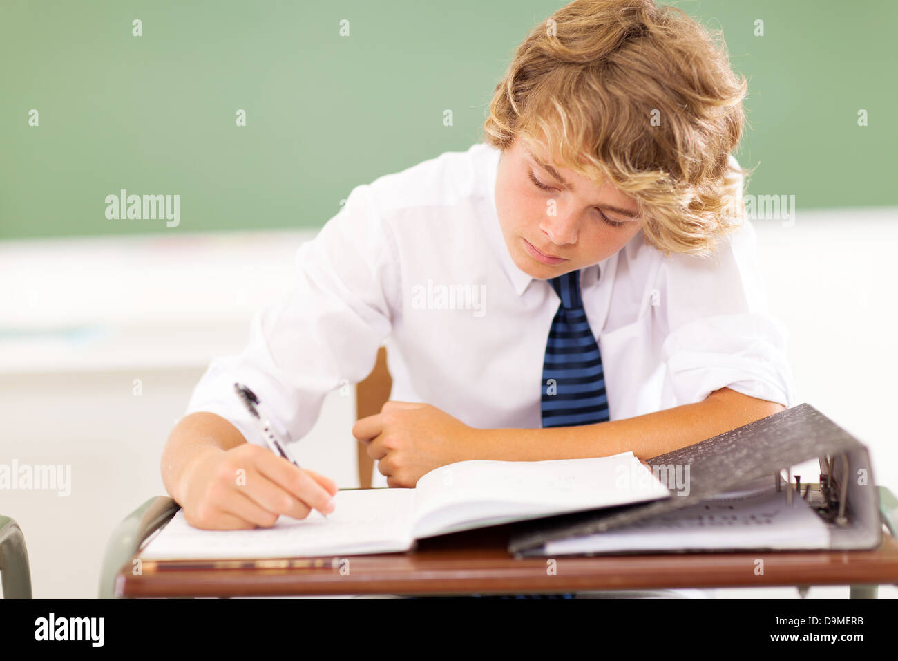 cute high school student writing in classroom Stock Photo - Alamy