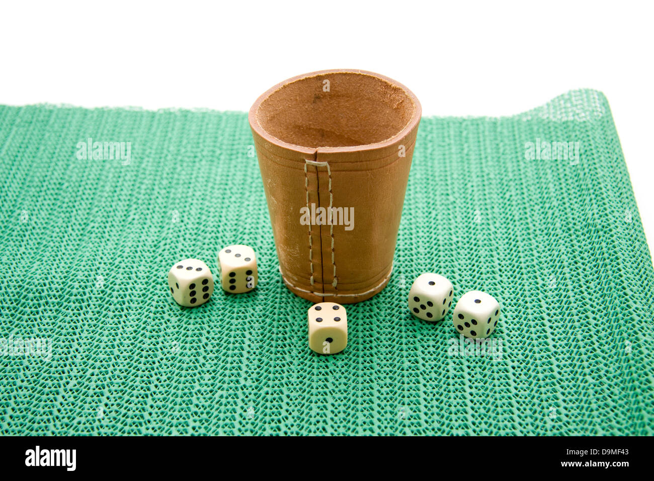 Dice cup with cube Stock Photo - Alamy