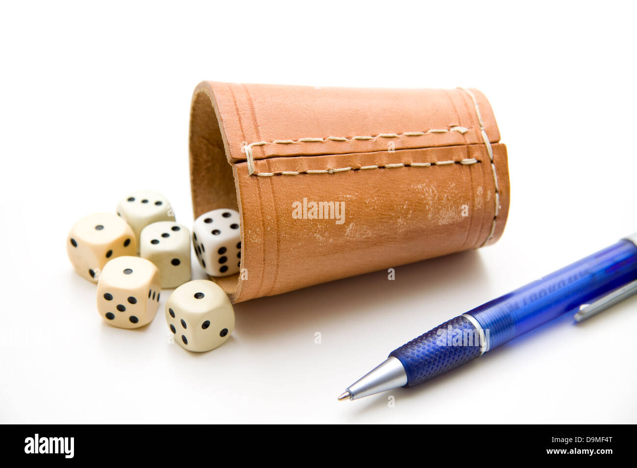 Dice cup and ballpoint pen Stock Photo - Alamy
